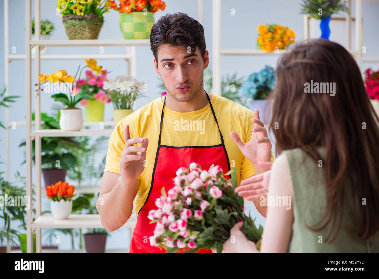 Florist selling flowers in a flower shop Stock Photo - Alamy