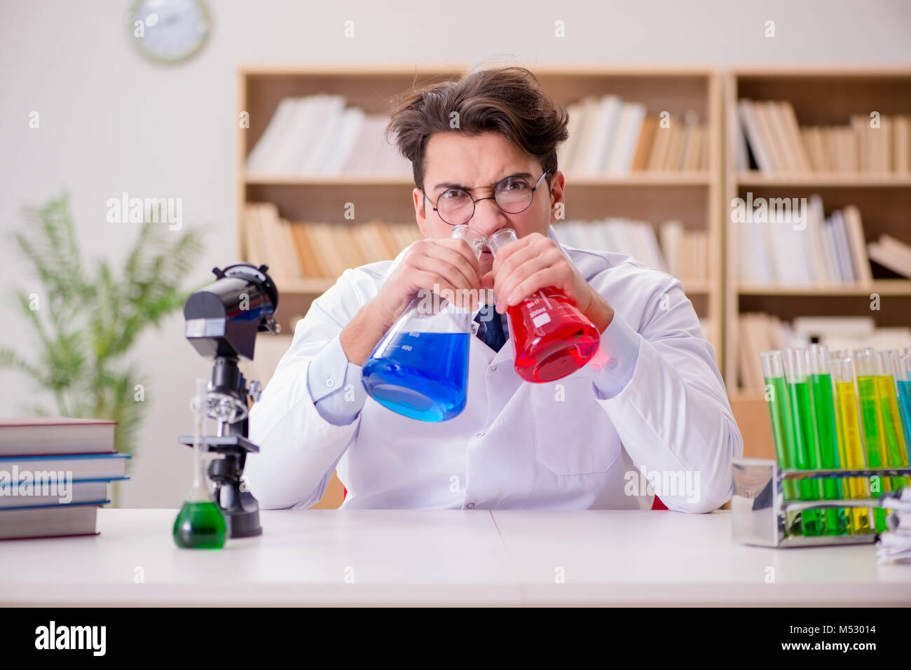 Mad crazy scientist doctor doing experiments in a laboratory Stock ...