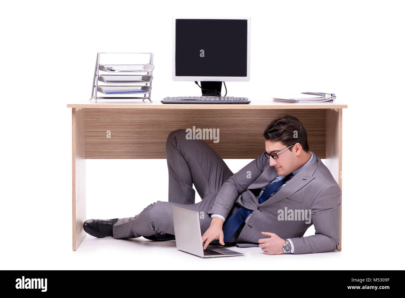 Businessman hiding in the ofice Stock Photo - Alamy