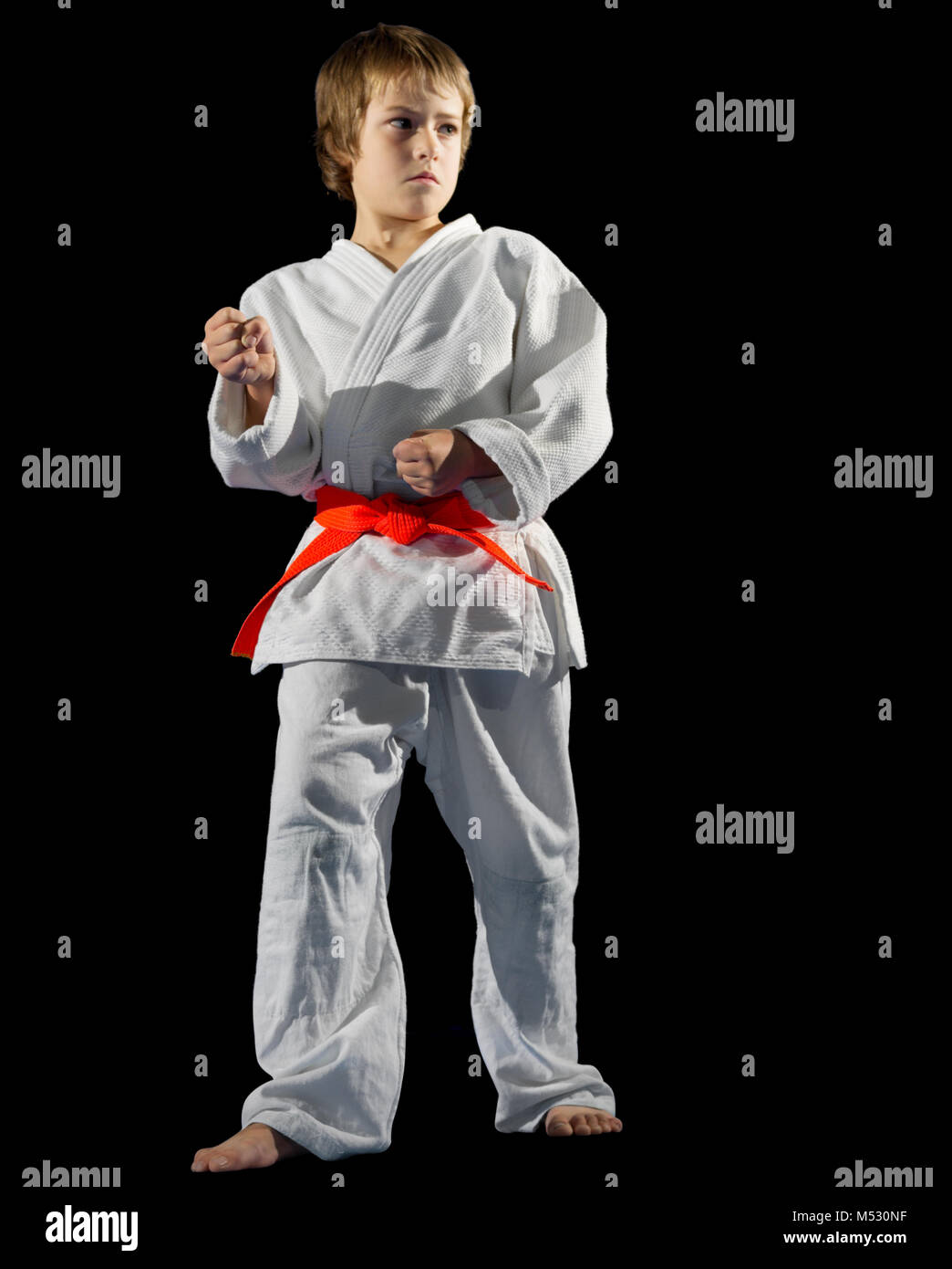 Little boy martial arts fighter isolated Stock Photo - Alamy