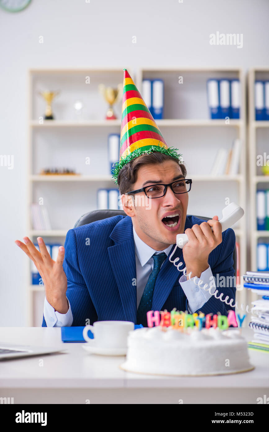 Man celebrating birthday in the office Stock Photo - Alamy
