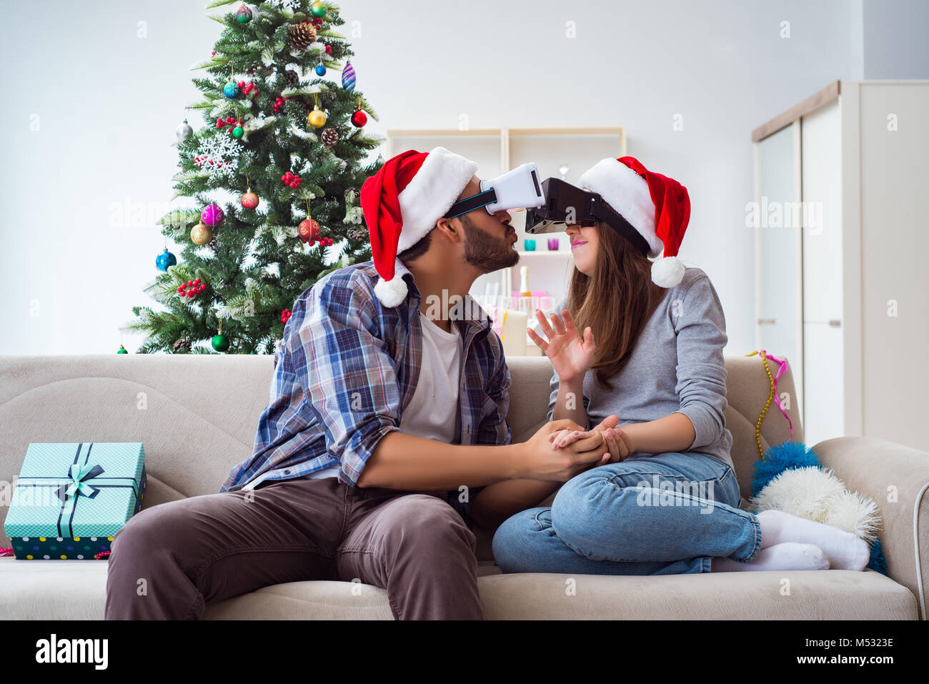Happy family using virtual reality VR glasses during christmas Stock ...