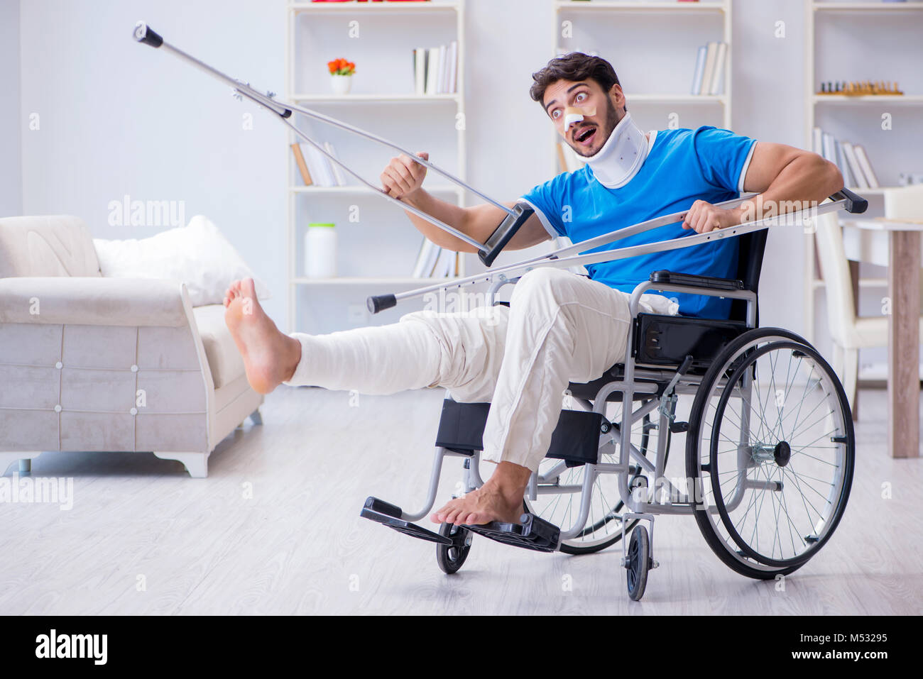 Injured young man recovering at home Stock Photo - Alamy