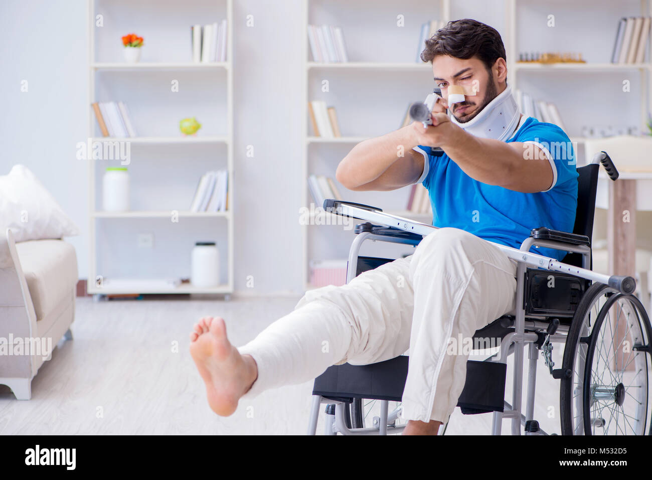 Injured young man recovering at home Stock Photo - Alamy