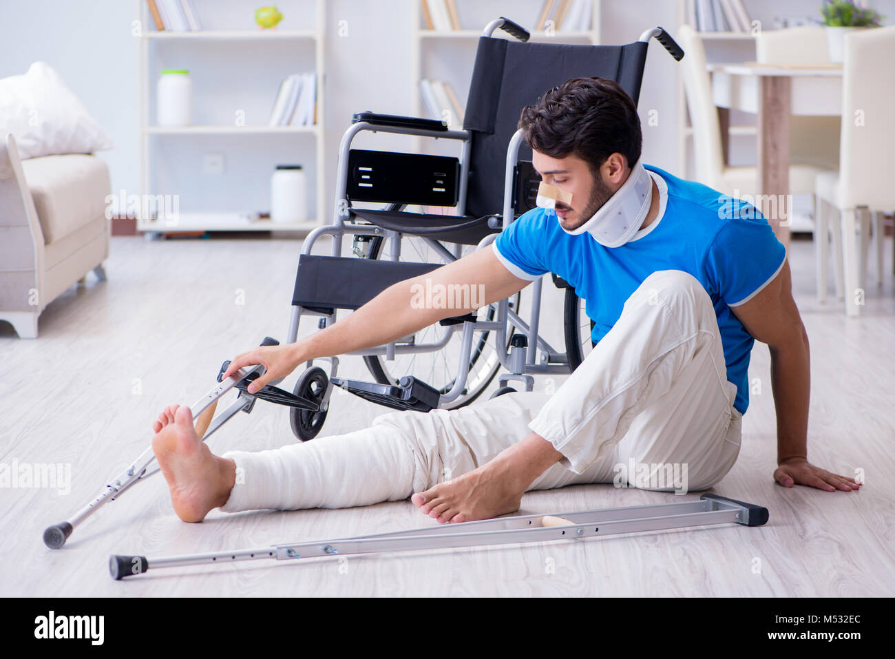 Injured young man recovering at home Stock Photo - Alamy