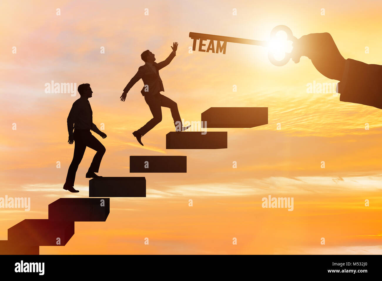 Businessmen on career ladder in teamwork concept Stock Photo - Alamy