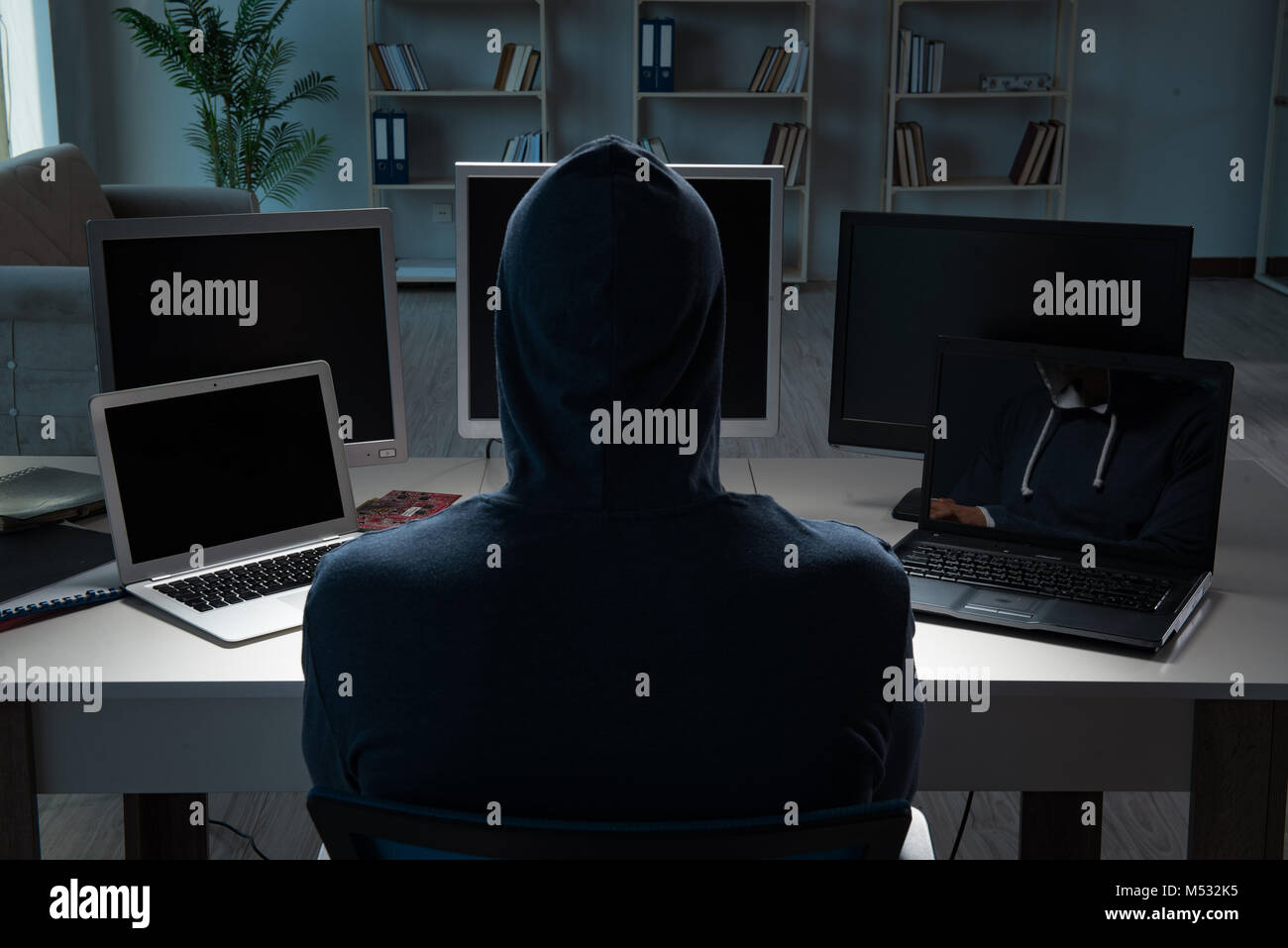 Hacker hacking computer at night Stock Photo - Alamy