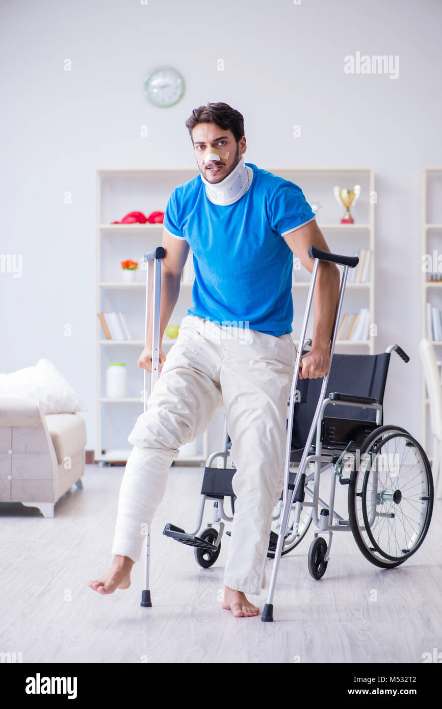 Injured young man recovering at home Stock Photo - Alamy