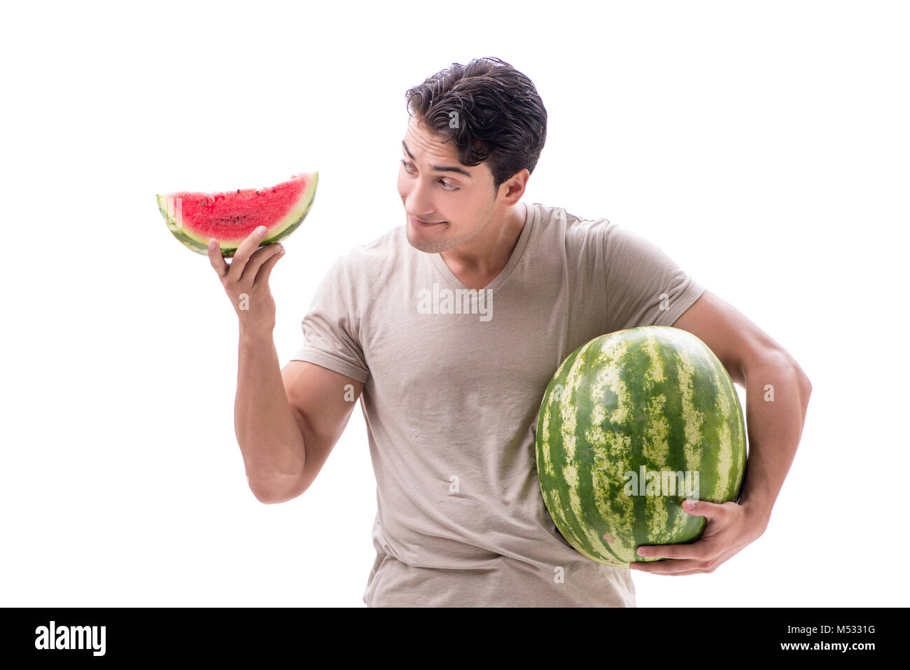 Young man with watermelon isolated on white Stock Photo - Alamy