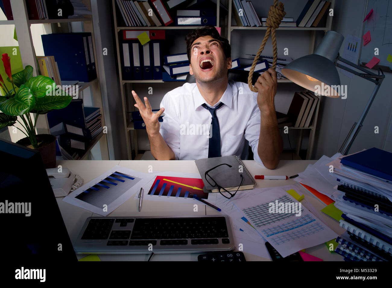 Man businessman working late hours in the office Stock Photo - Alamy
