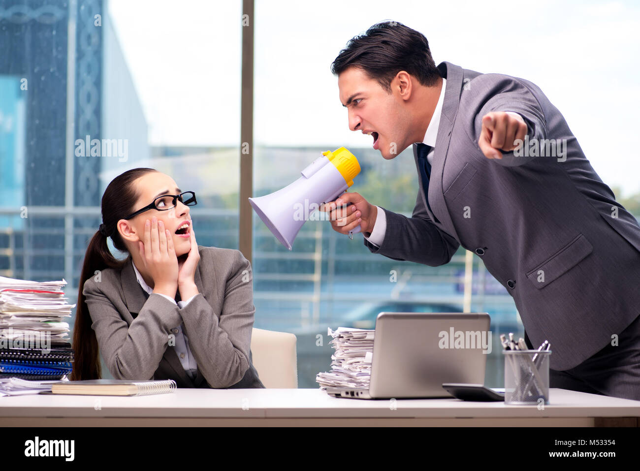 Boss yelling at his team member Stock Photo - Alamy
