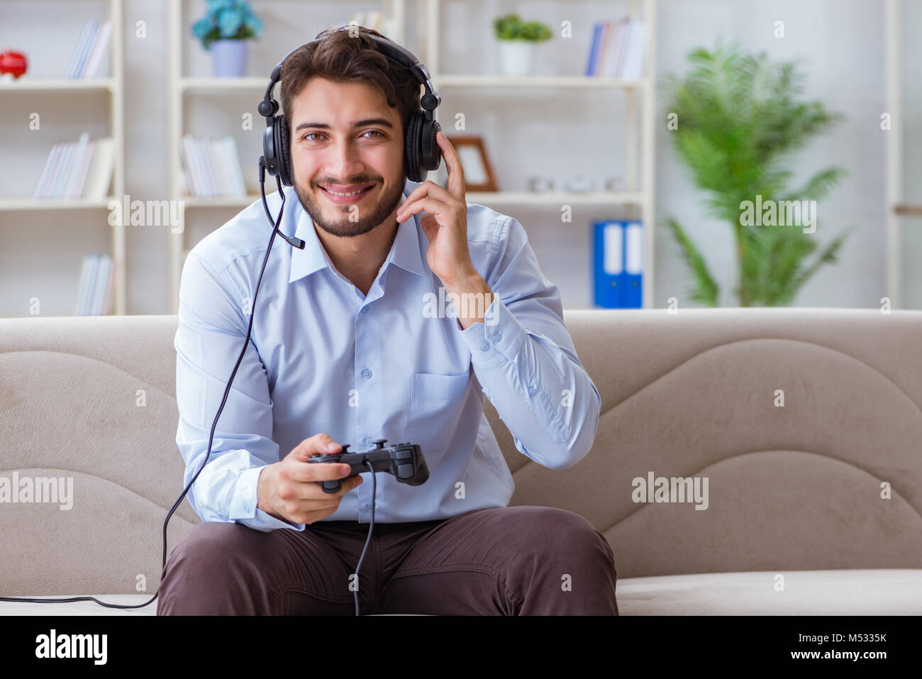 Student gamer playing games at home Stock Photo - Alamy
