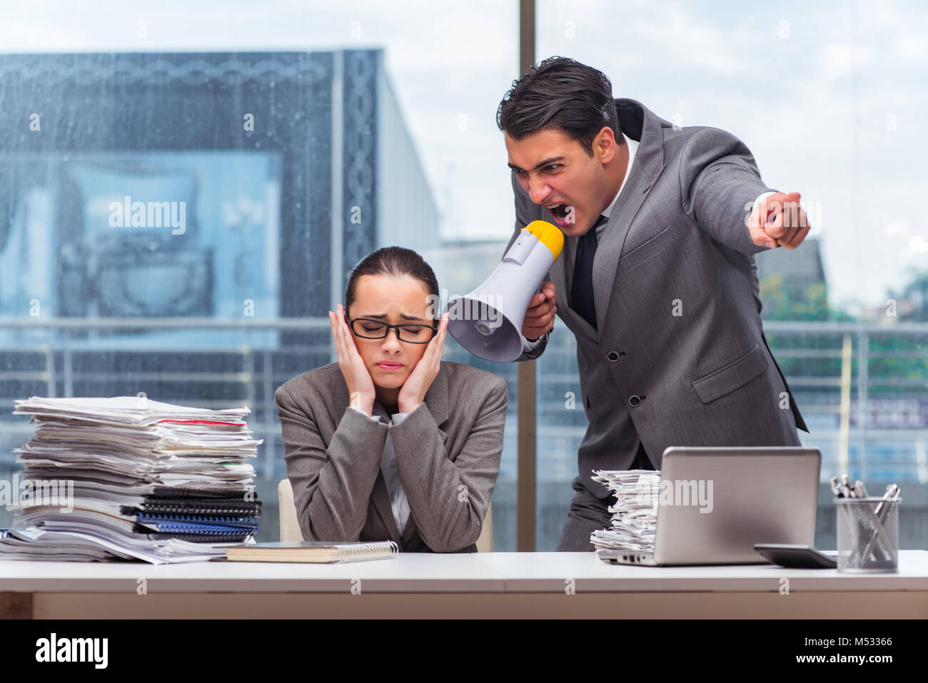 Boss yelling at his team member Stock Photo - Alamy