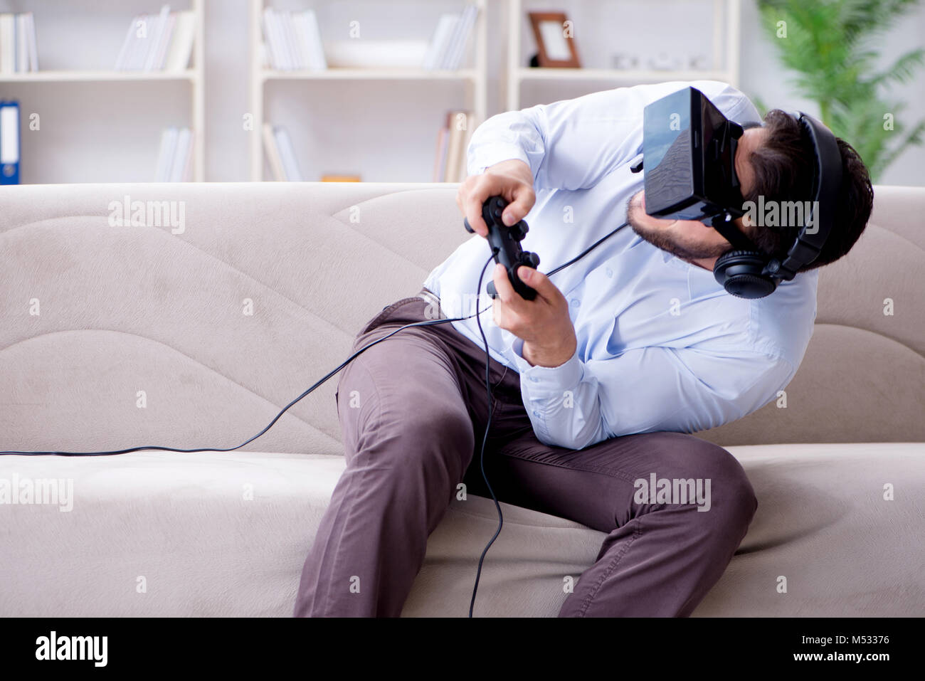 Student gamer playing games at home Stock Photo - Alamy