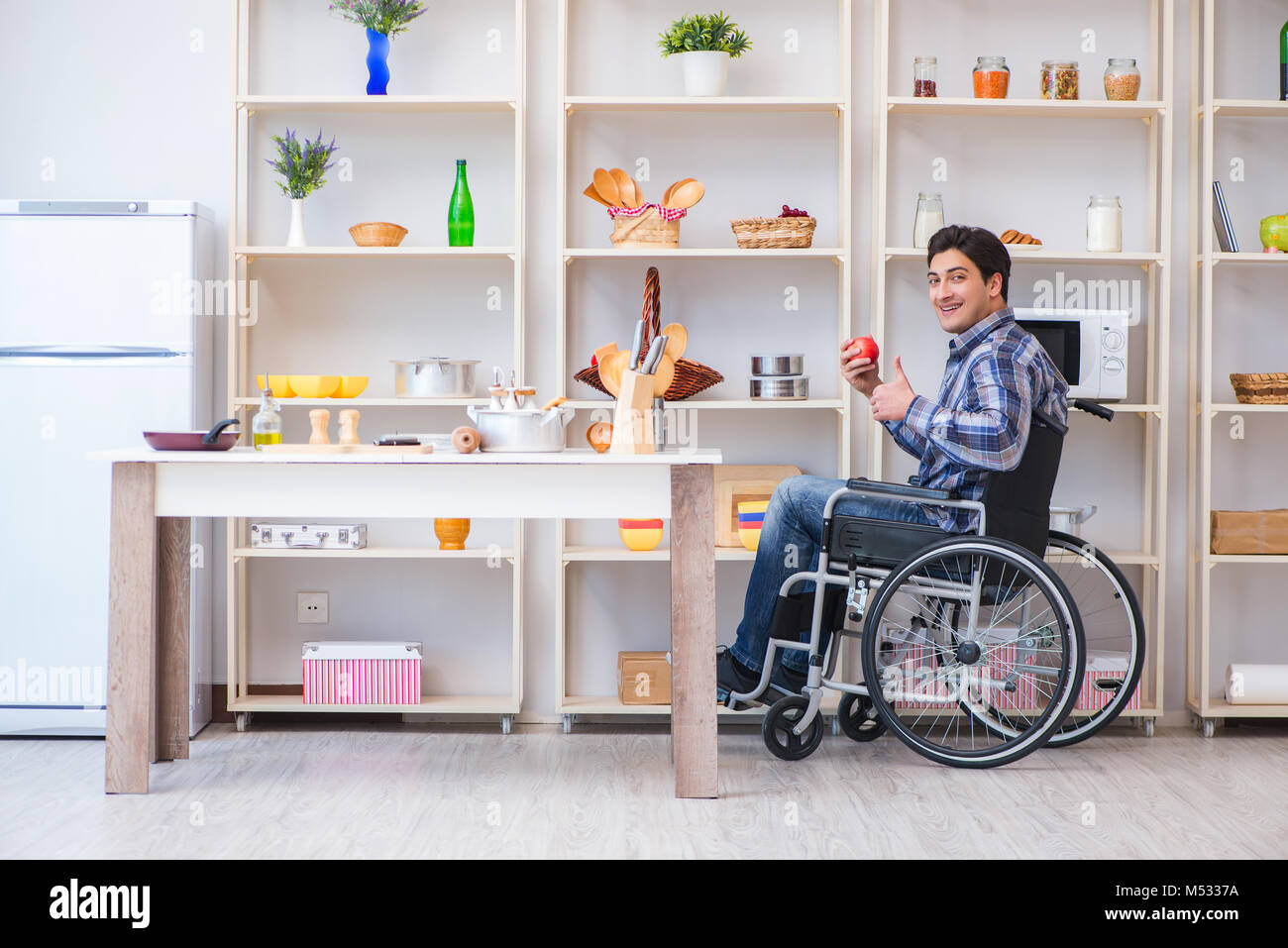 Disabled man eating lunch hi-res stock photography and images - Alamy