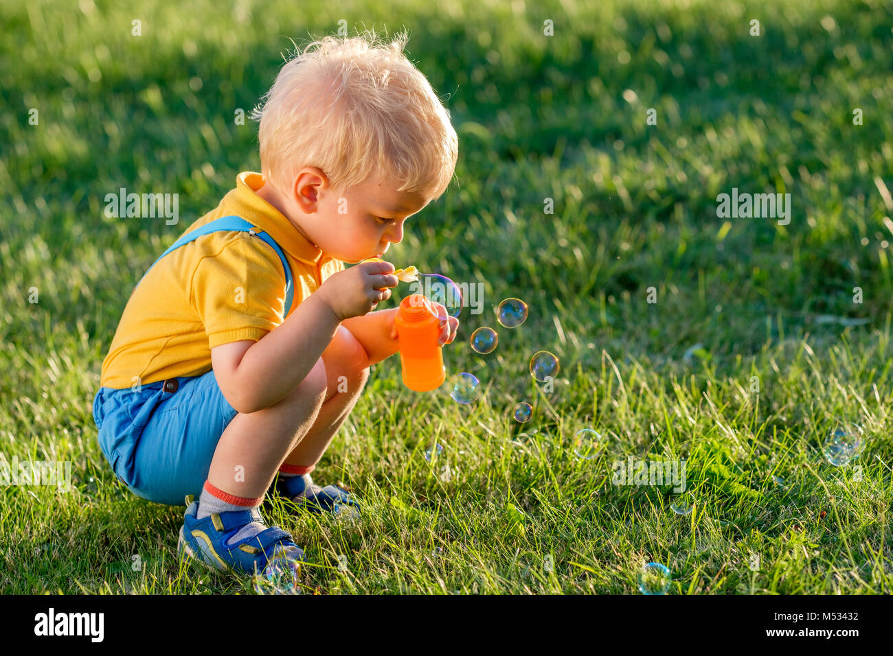 Year old boy blowing bubbles hi-res stock photography and images - Alamy