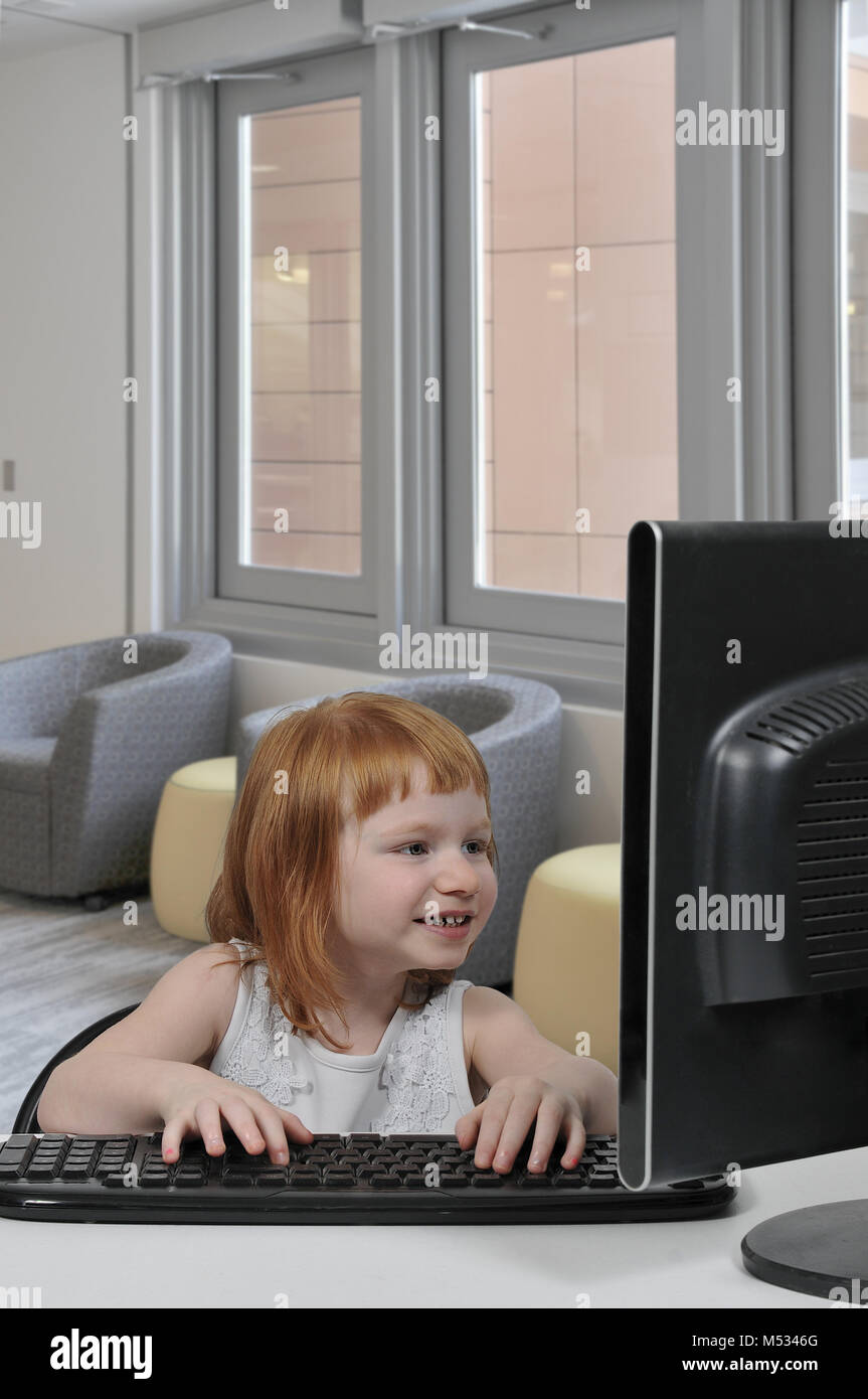 Little Girl Using Computer Stock Photo - Alamy
