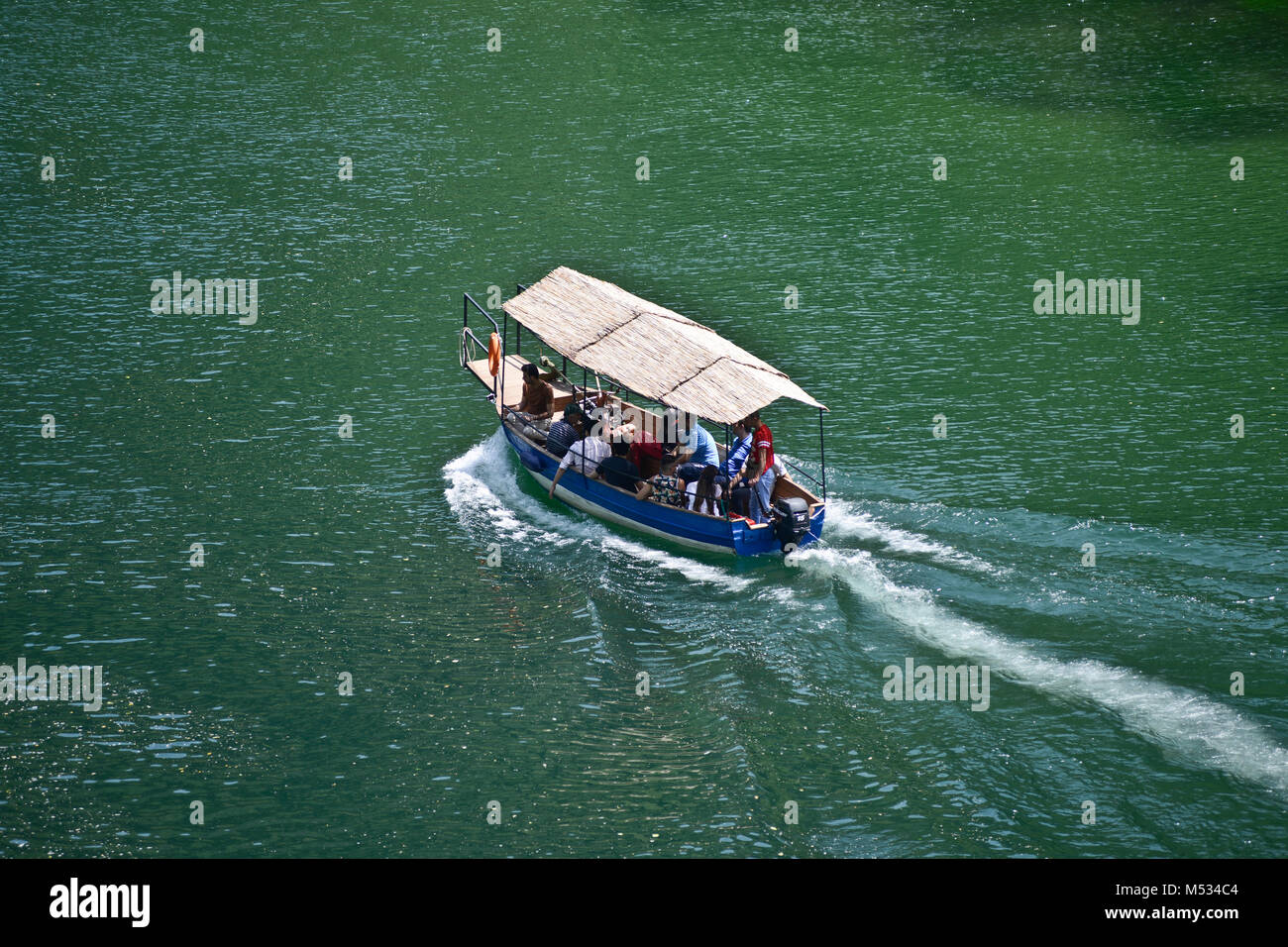 Tourist boat navigating Matka Lake, Matka Canyon, Macedonia Stock Photo ...