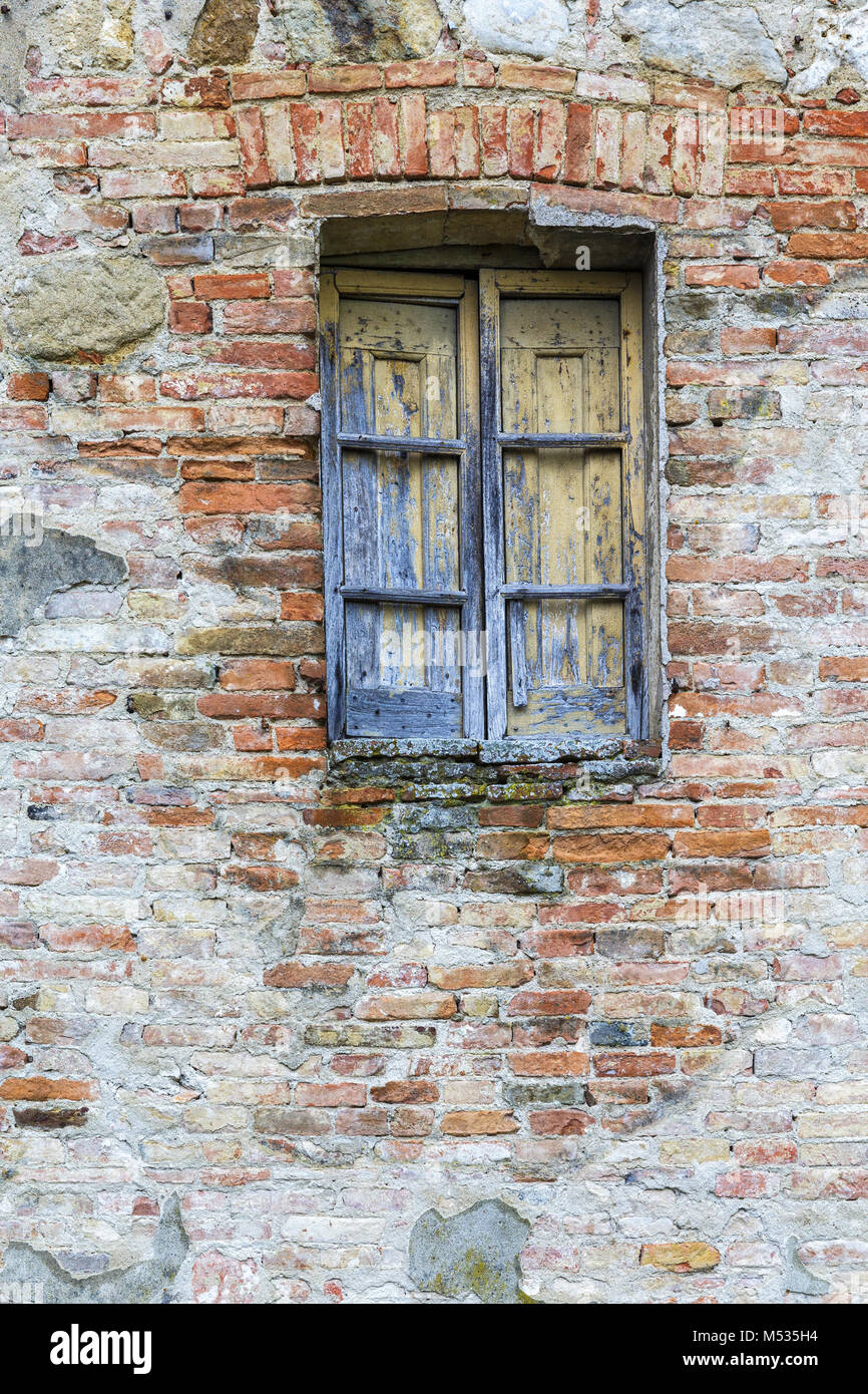 Old weathered window on a brick wall Stock Photo - Alamy
