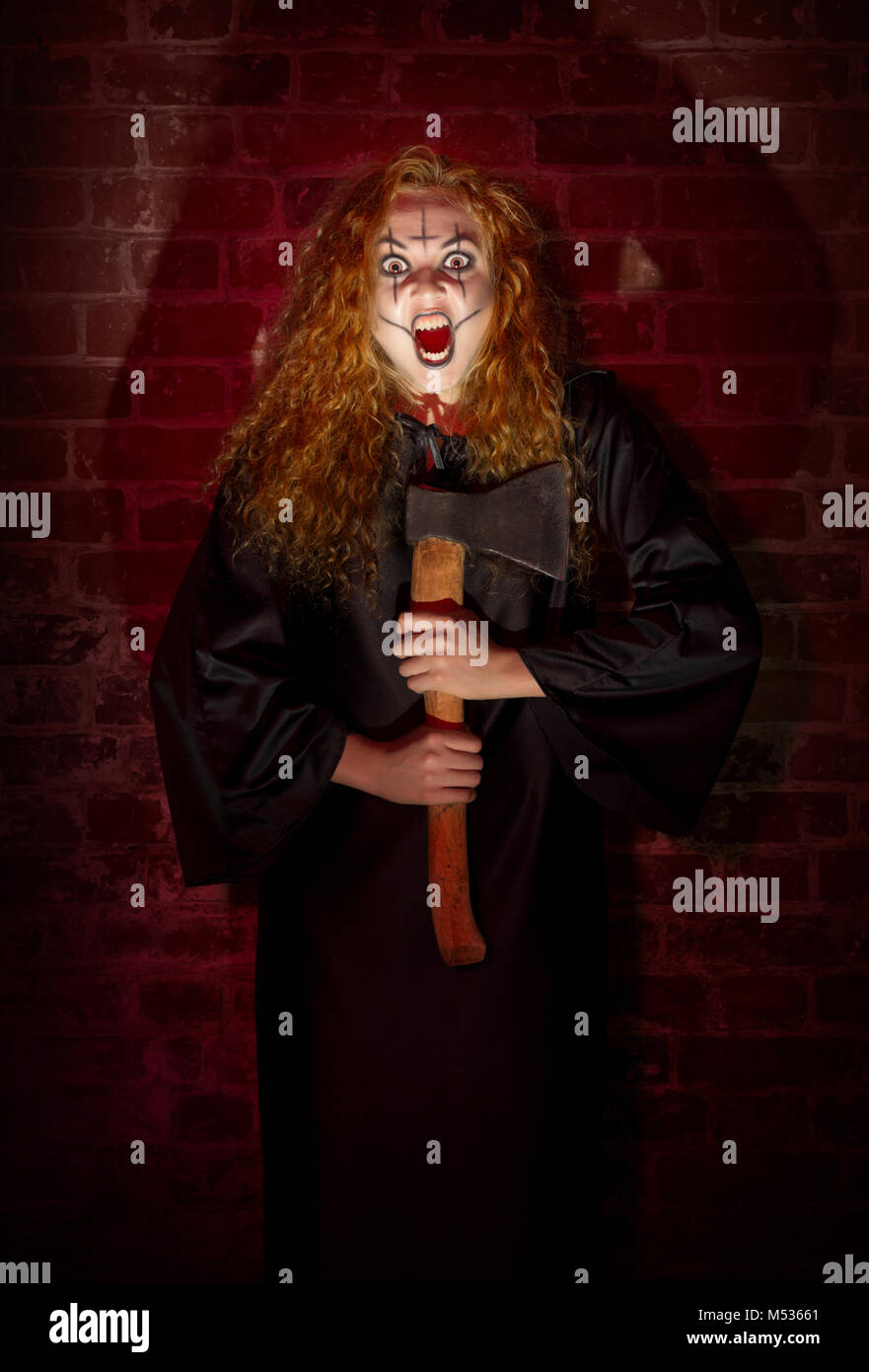 Scary witch on brick background Stock Photo - Alamy