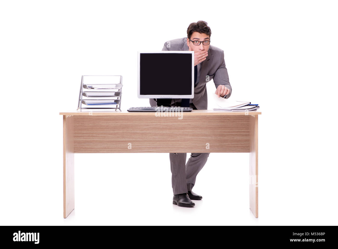 Businessman hiding in the office isolated on white Stock Photo - Alamy