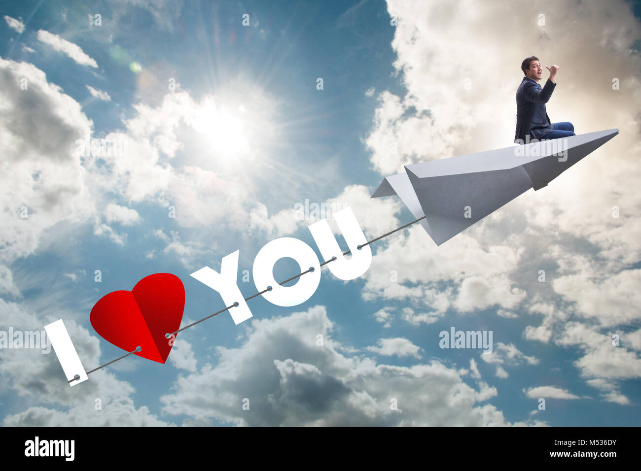 Romantic concept with man on paper plane I Love you Stock Photo - Alamy
