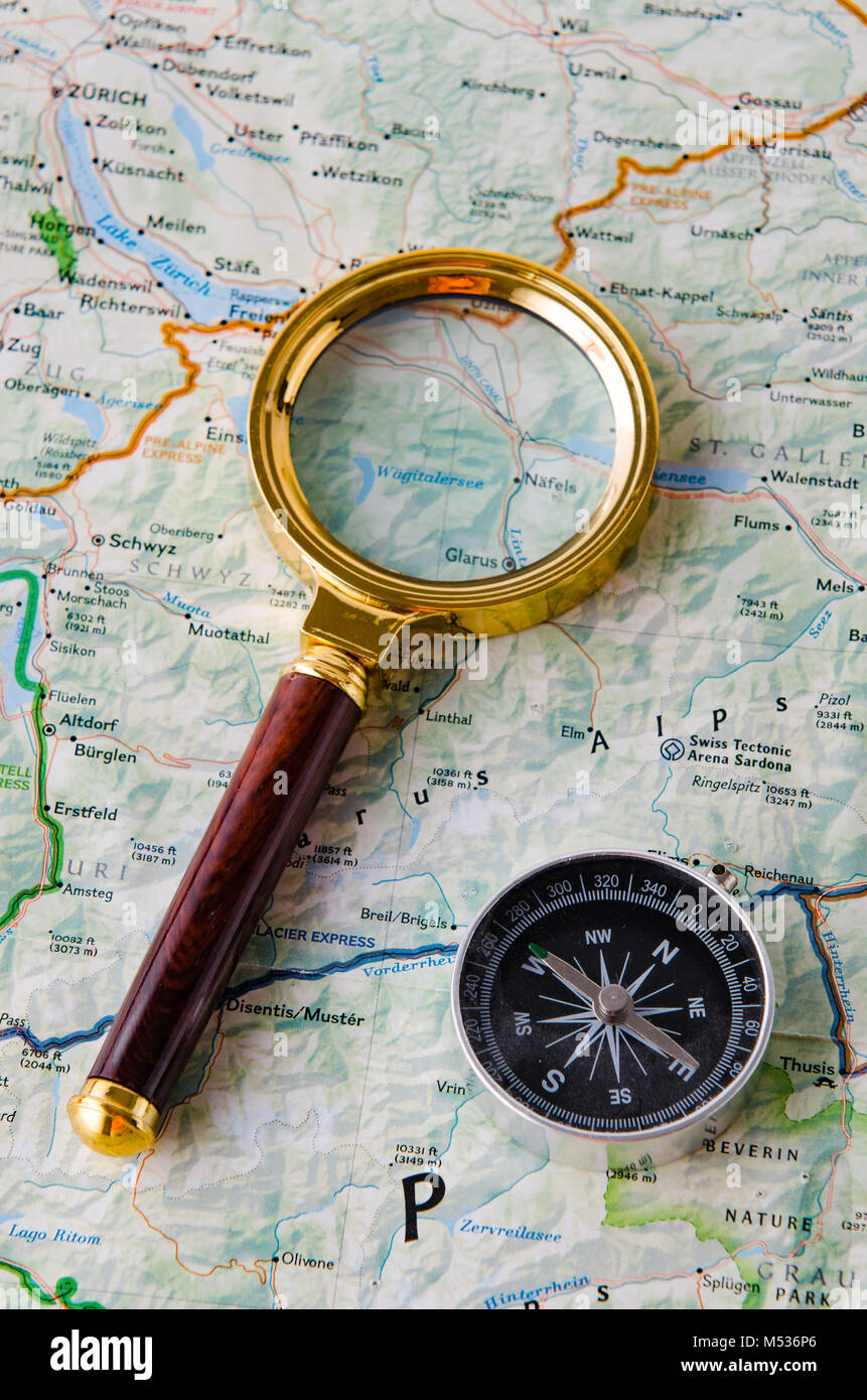Travel concept with compass and map Stock Photo - Alamy