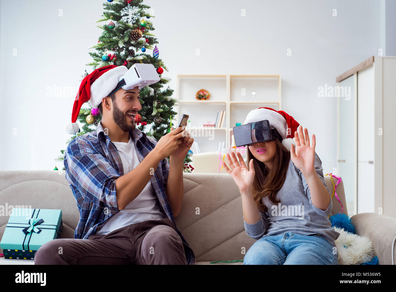 Happy family using virtual reality VR glasses during christmas Stock ...
