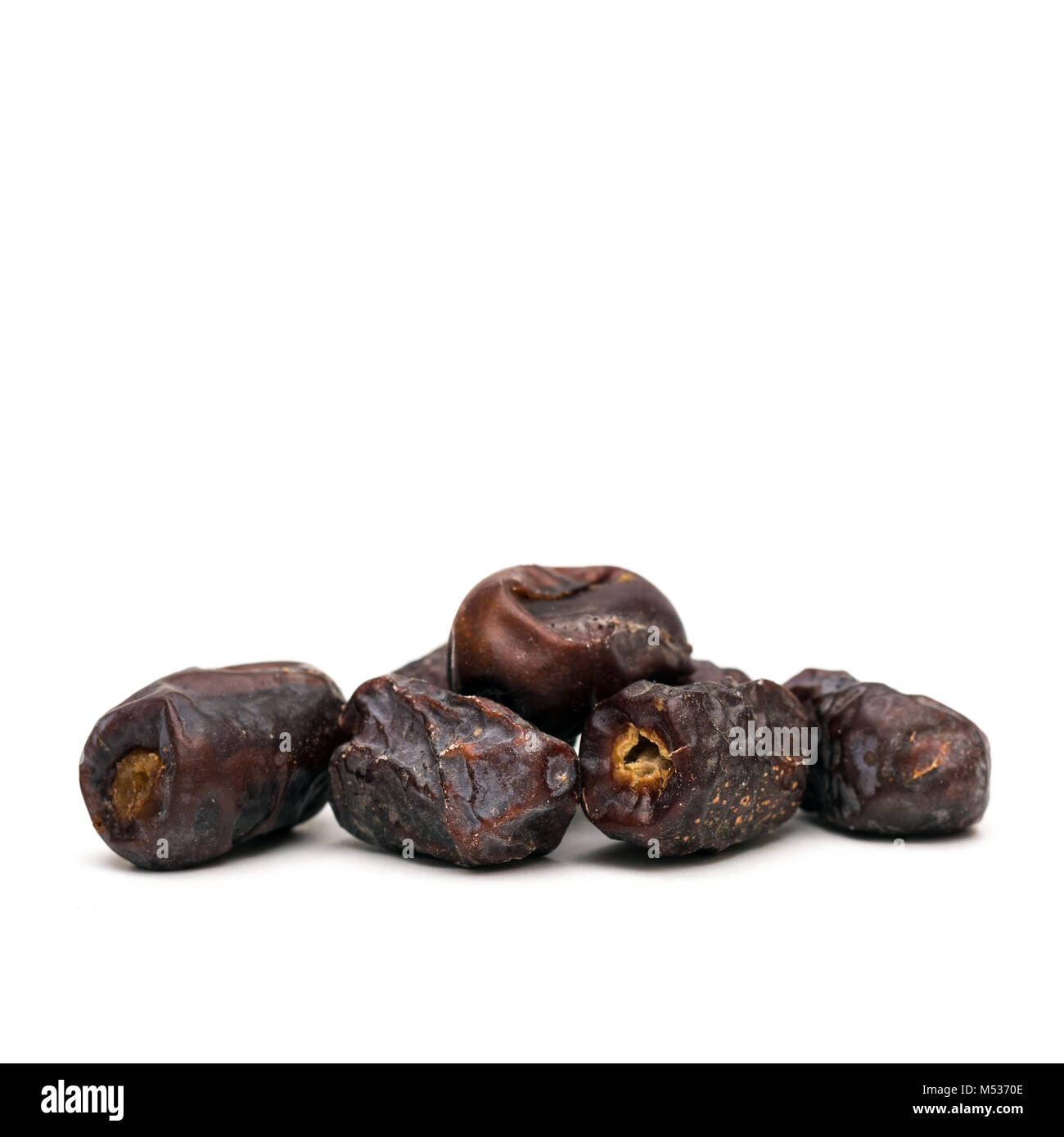 Dates on white background Stock Photo - Alamy