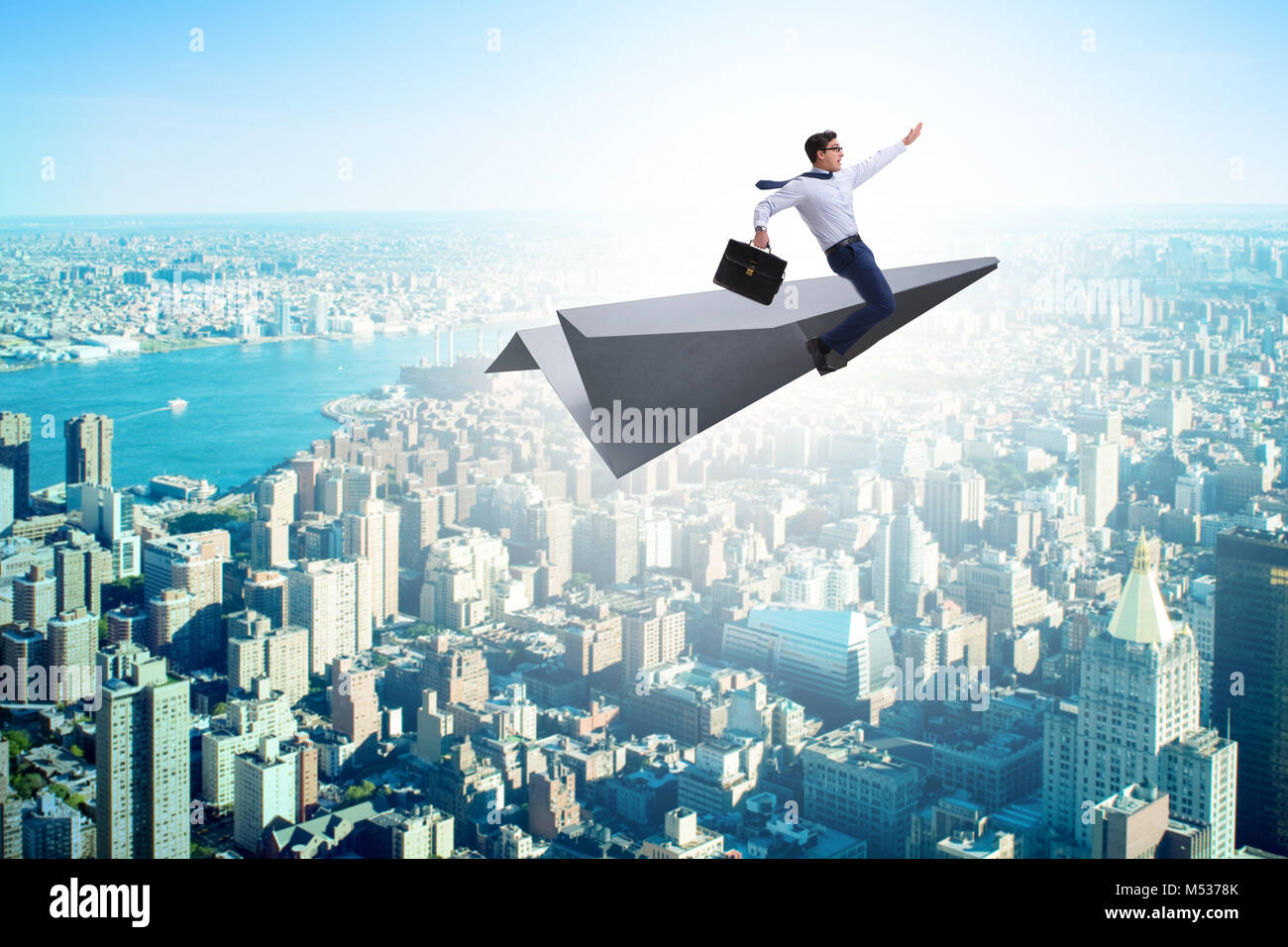 Businessman flying on paper plane in business concept Stock Photo - Alamy