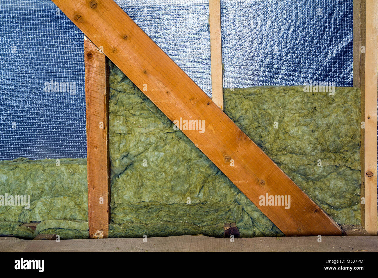 Thermal insulation mineral rock wool installation at the new building ...