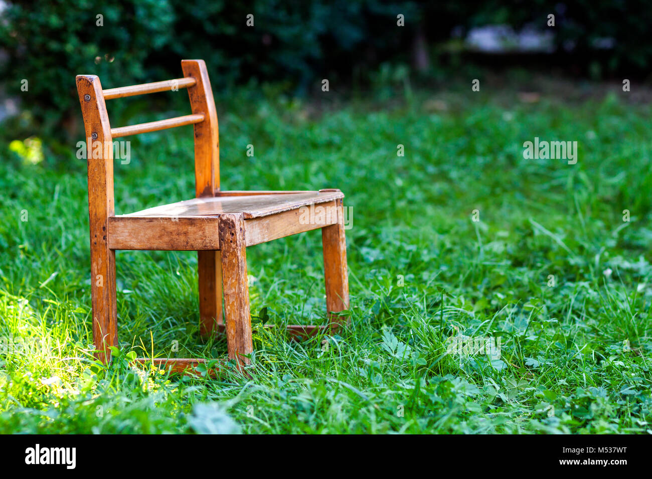 Little old chair on green grass Stock Photo - Alamy