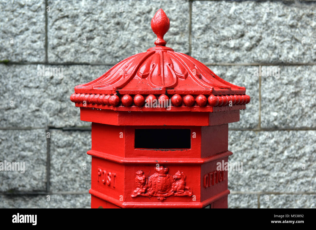 An old or antique vintage post box or posting postal box with an ornate ...