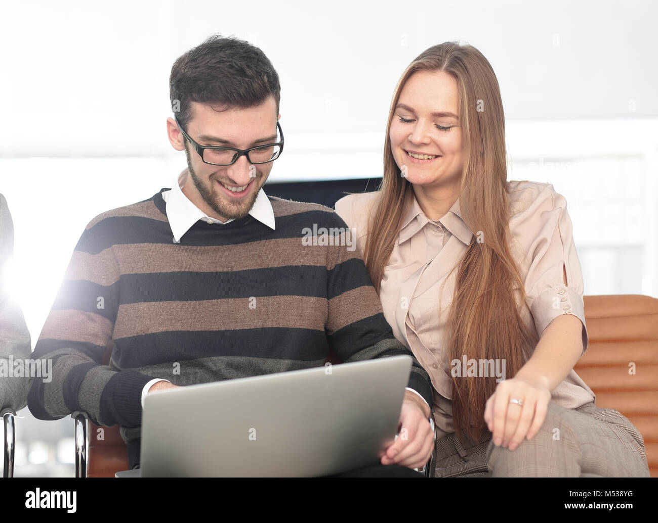 employees working on laptop Stock Photo - Alamy