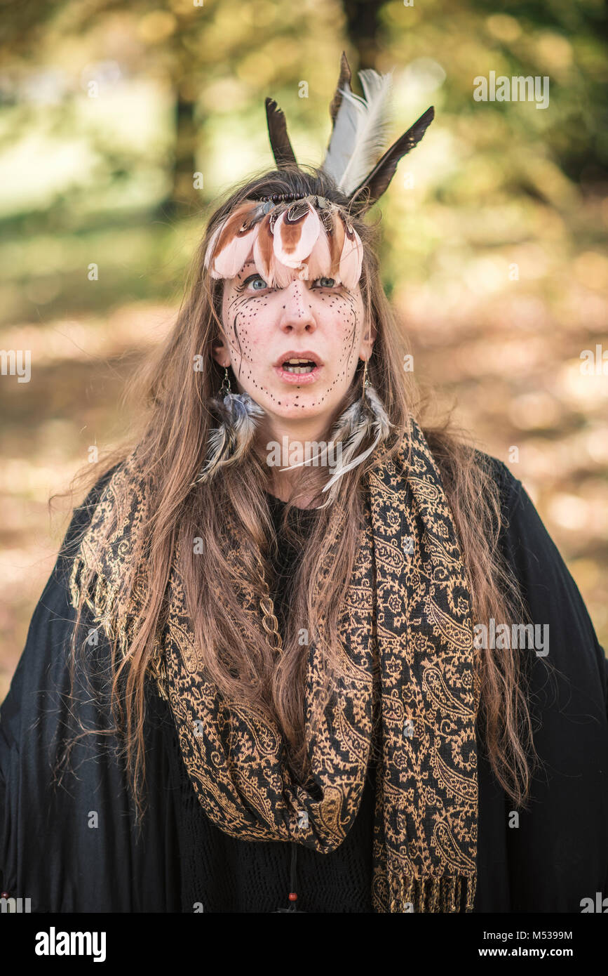 Shaman tribal woman casting ritual magic in nature Stock Photo - Alamy