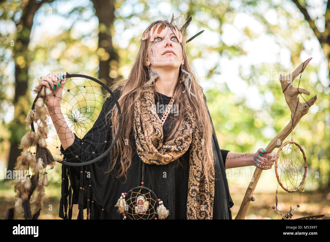 Shaman tribal woman casting ritual magic in nature Stock Photo - Alamy