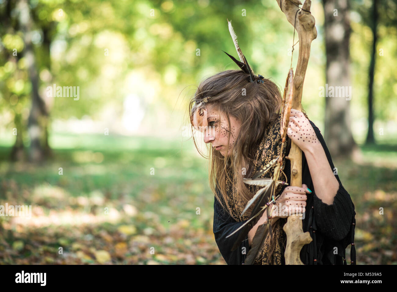 Shaman tribal woman casting ritual magic in nature Stock Photo - Alamy