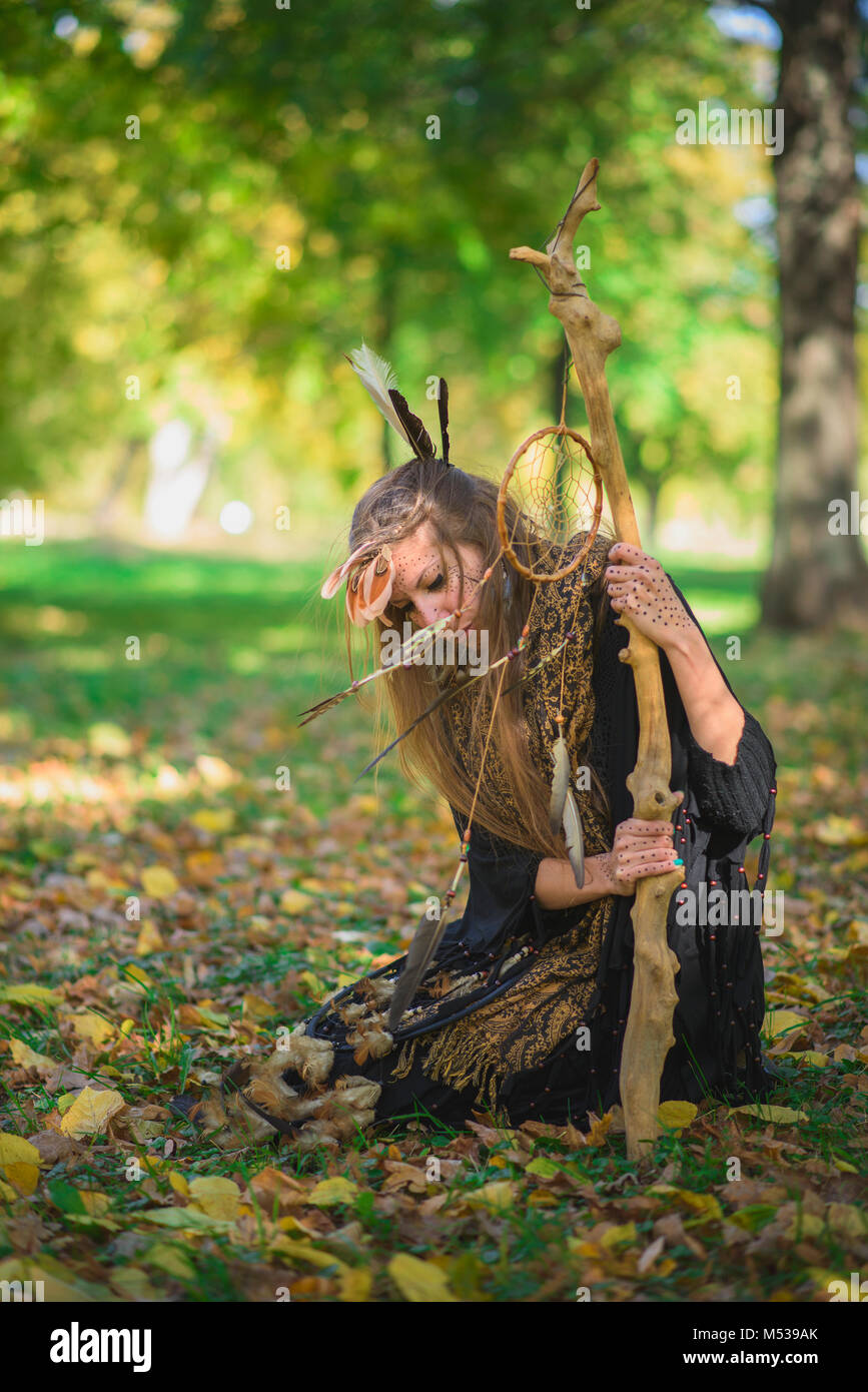 Shaman tribal woman casting ritual magic in nature Stock Photo - Alamy