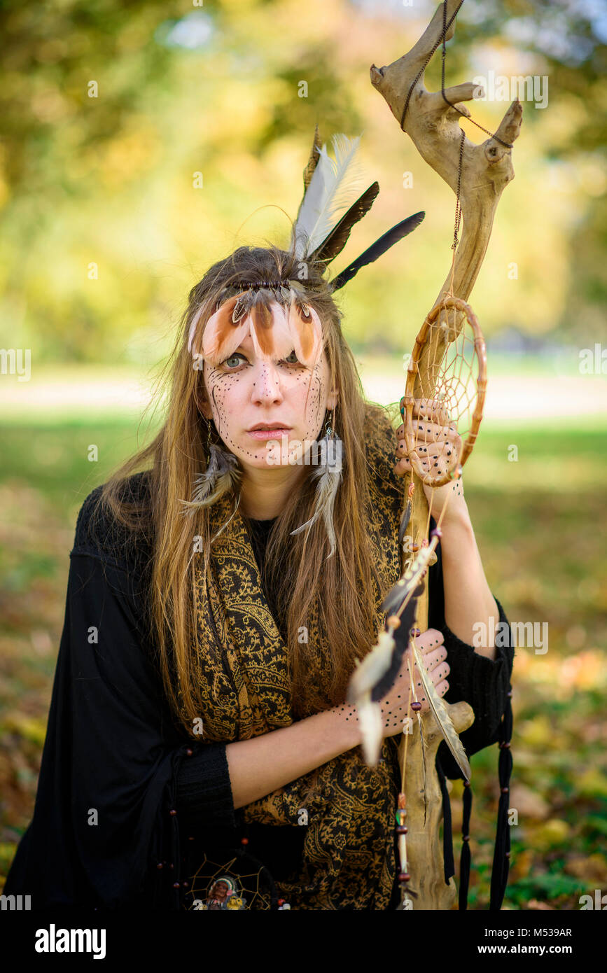 Shaman tribal woman casting ritual magic in nature Stock Photo - Alamy