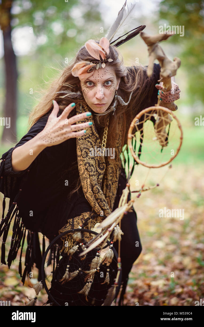 Shaman tribal woman casting ritual magic in nature Stock Photo - Alamy
