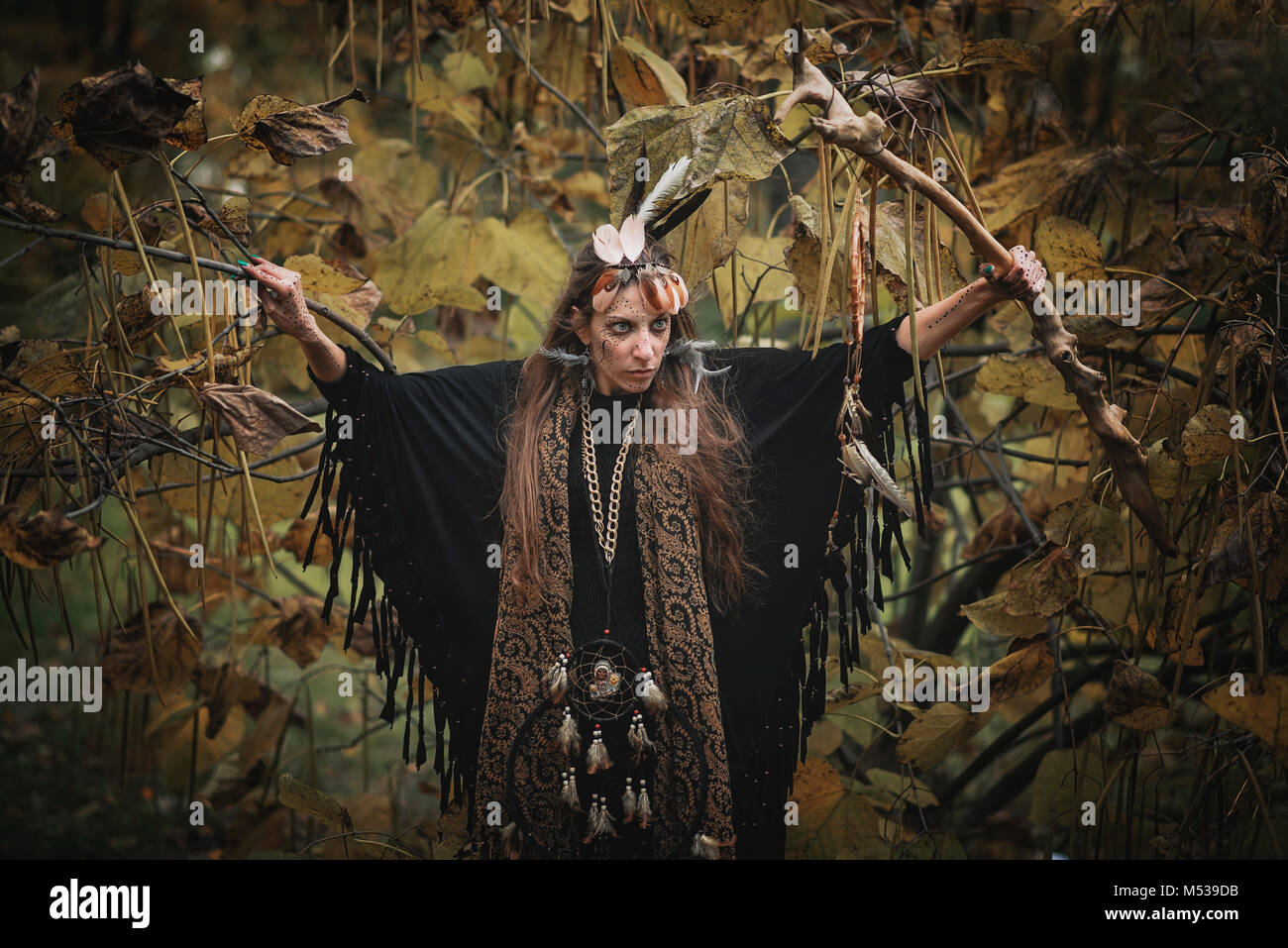 Shaman tribal woman casting ritual magic in nature Stock Photo - Alamy
