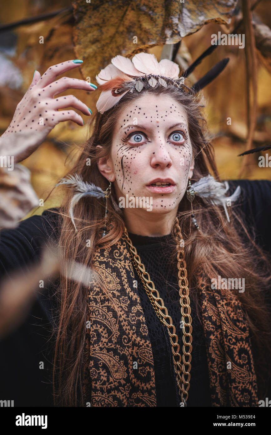 Shaman tribal woman casting ritual magic in nature Stock Photo - Alamy