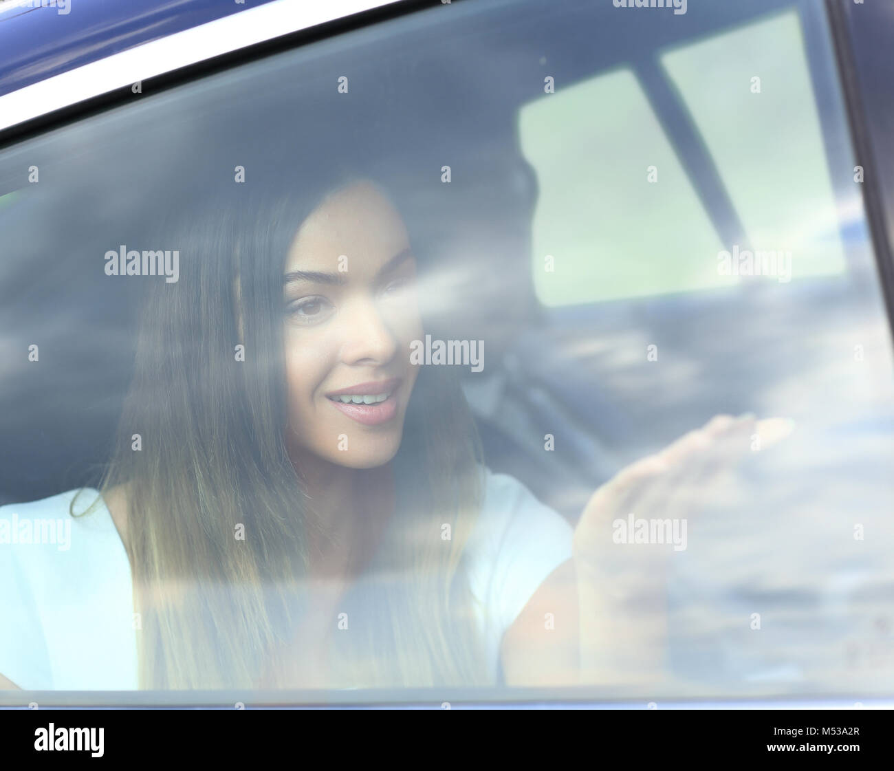 young woman portrait in the car behind the window Stock Photo - Alamy