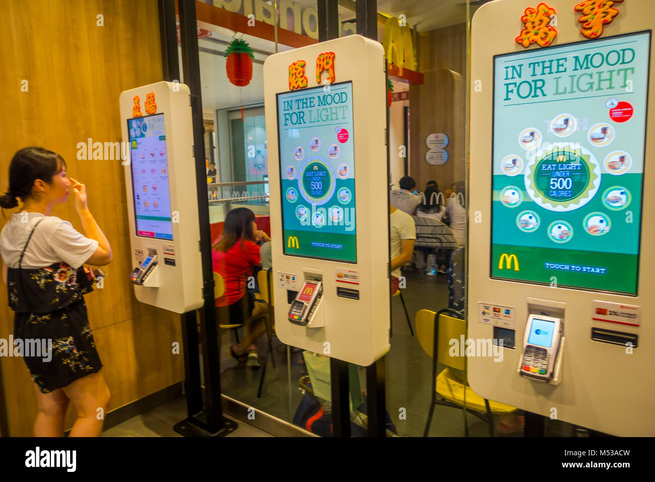 SINGAPORE, SINGAPORE - FEBRUARY 01, 2018: Self-service kiosks at ...