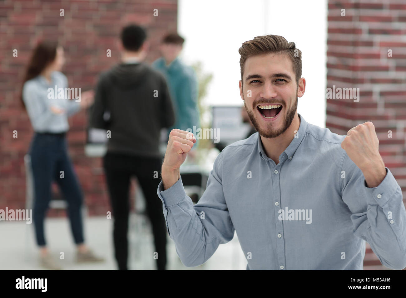 Handsome businessman celebrating victory shouting happily in th Stock ...