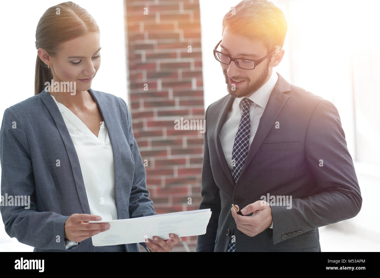 colleagues discussing business documents Stock Photo - Alamy
