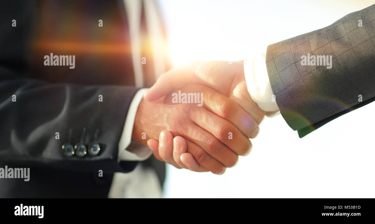 Business men giving a handshake. Business concept Stock Photo - Alamy