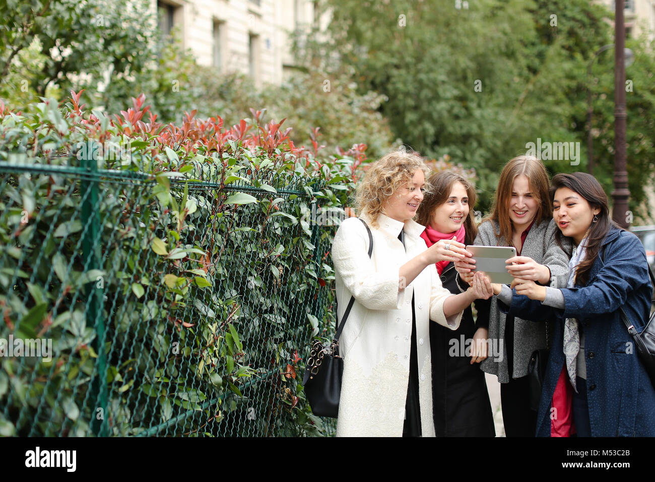 International students talking with teacher outdoors in Stock Photo - Alamy