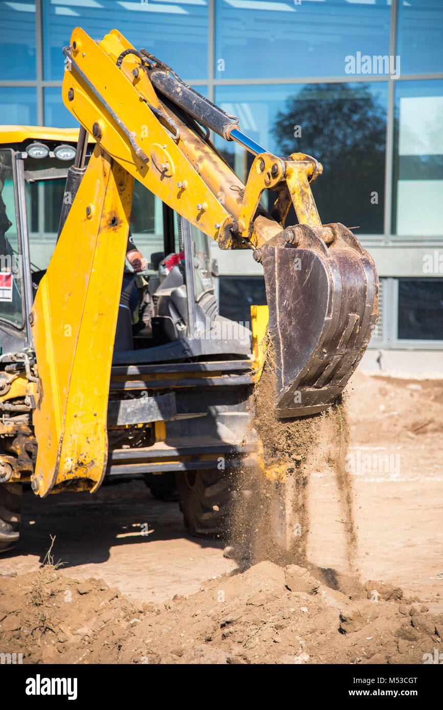 Construction work with digger machines Stock Photo - Alamy