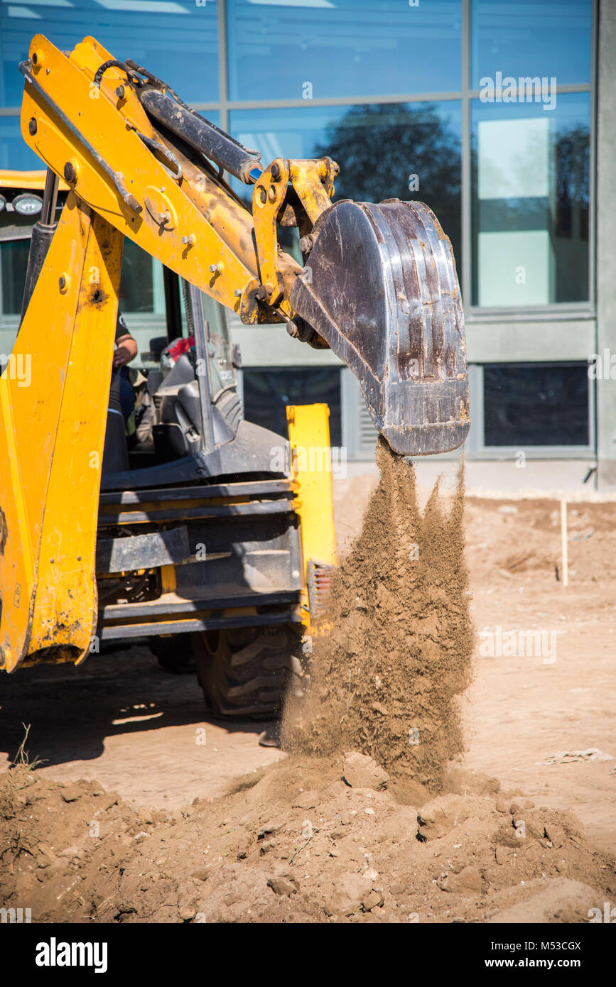 Construction work with digger machines Stock Photo - Alamy